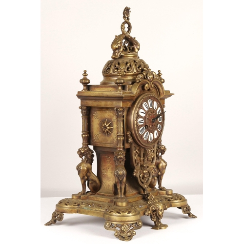 Victorian ornate brass mantel clock, with double fish finials, the dial ...