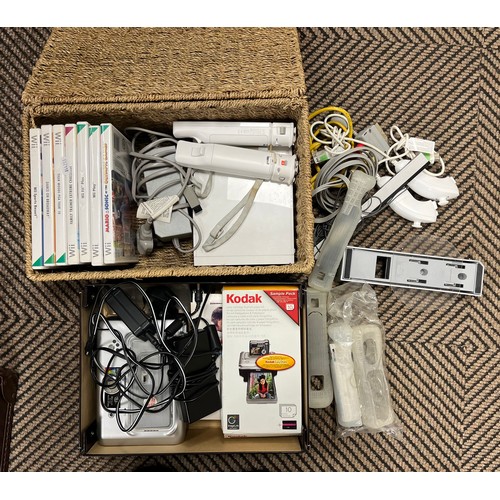 Nintendo Wii console with accessories and a Kodak Polaroid printer.