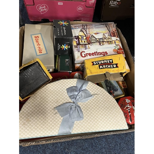 Box containing vintage tins and boxes.