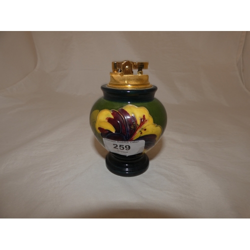 Moorcroft Hibiscus tube-lined table lighter, with fitted box.
