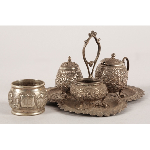 Indian white metal condiment set with a napkin ring, gross weight 269g.