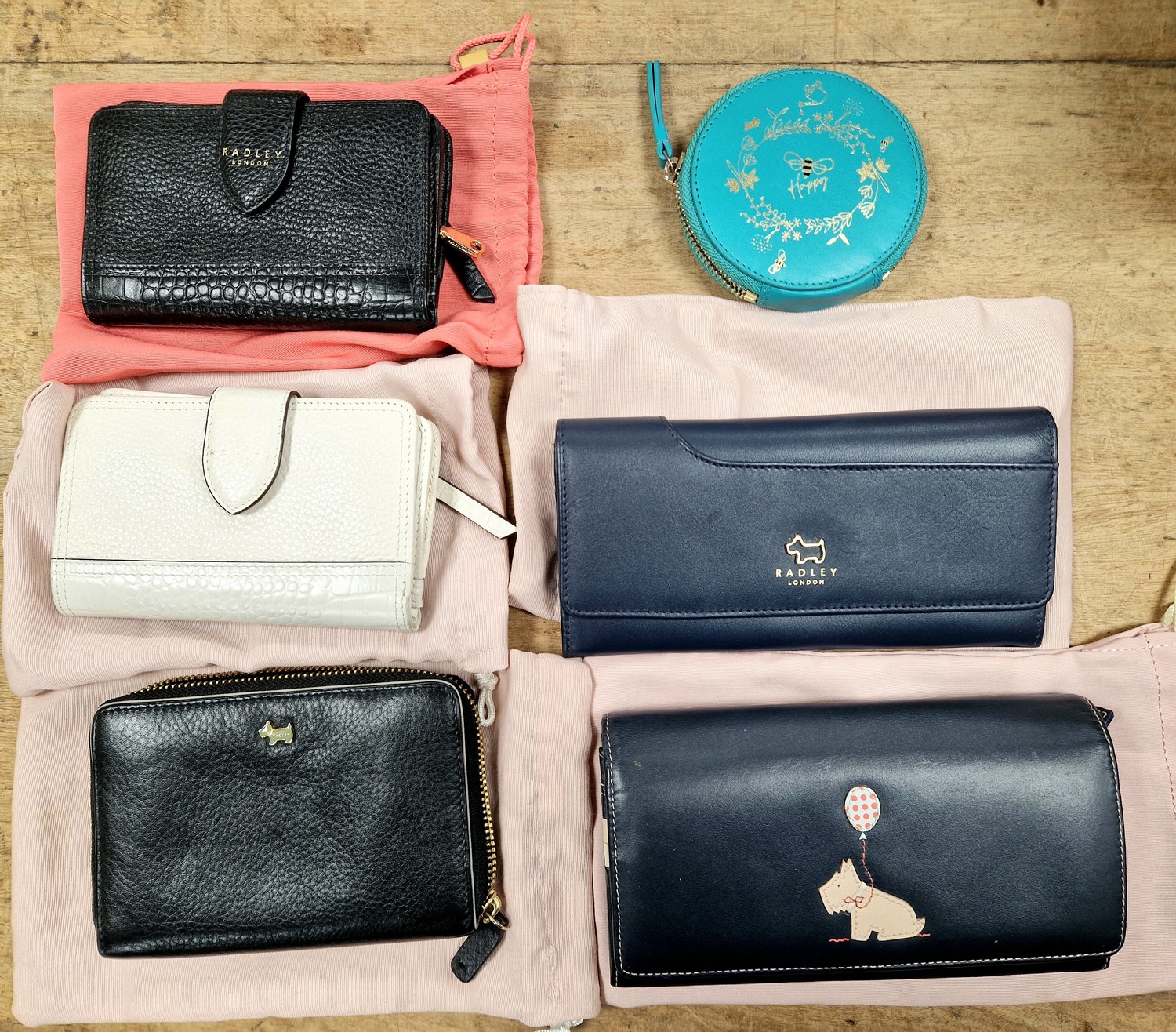 Six Radley leather purses.