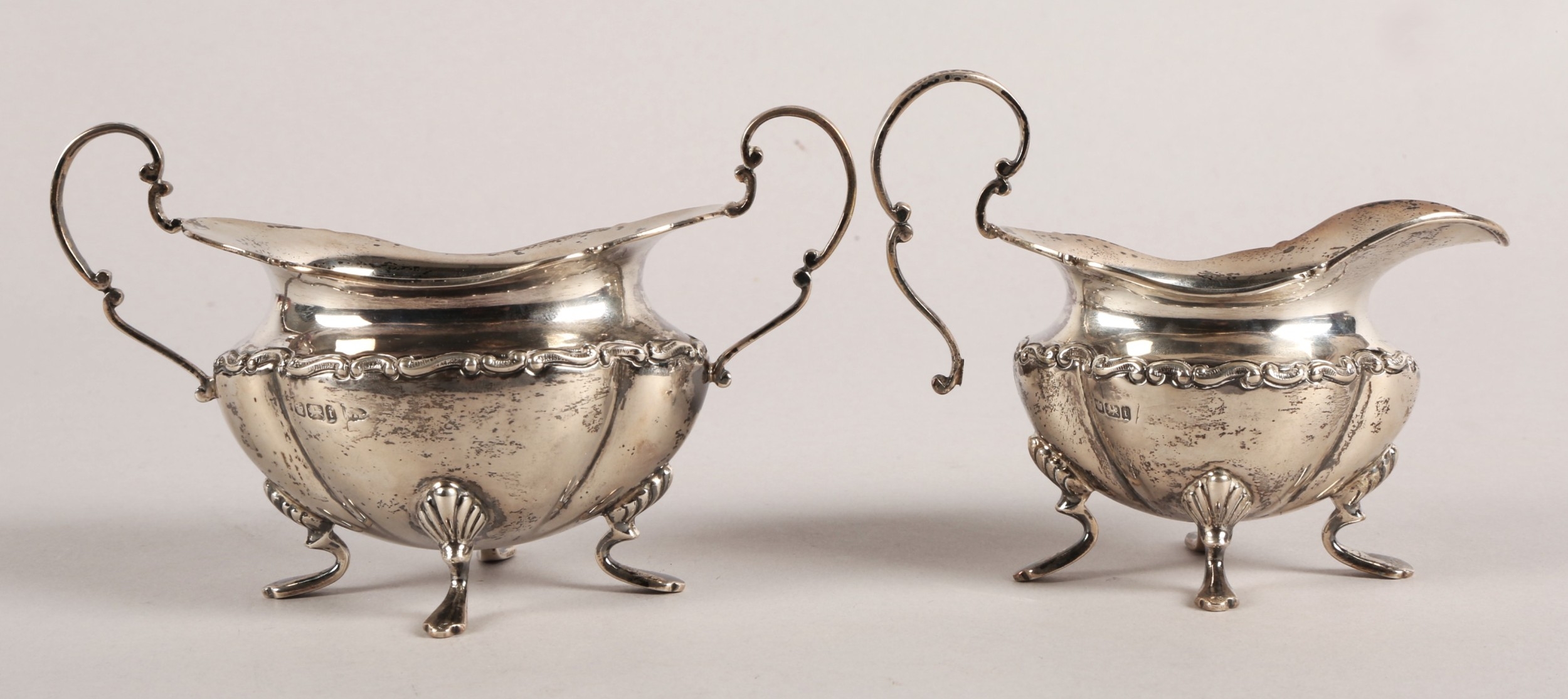 Cased silver sugar pot and cream jug, hallmarked Sheffield 1901, gross ...