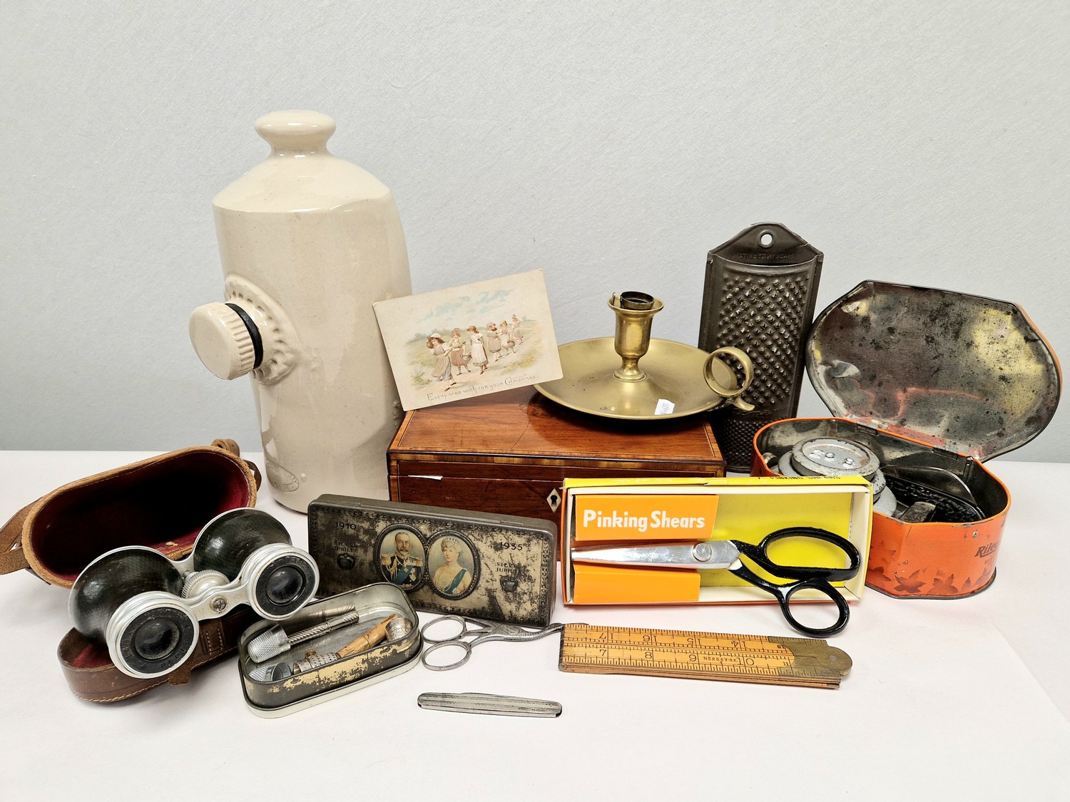 Wooden box with assorted vintage items, to include binoculars, silver ...