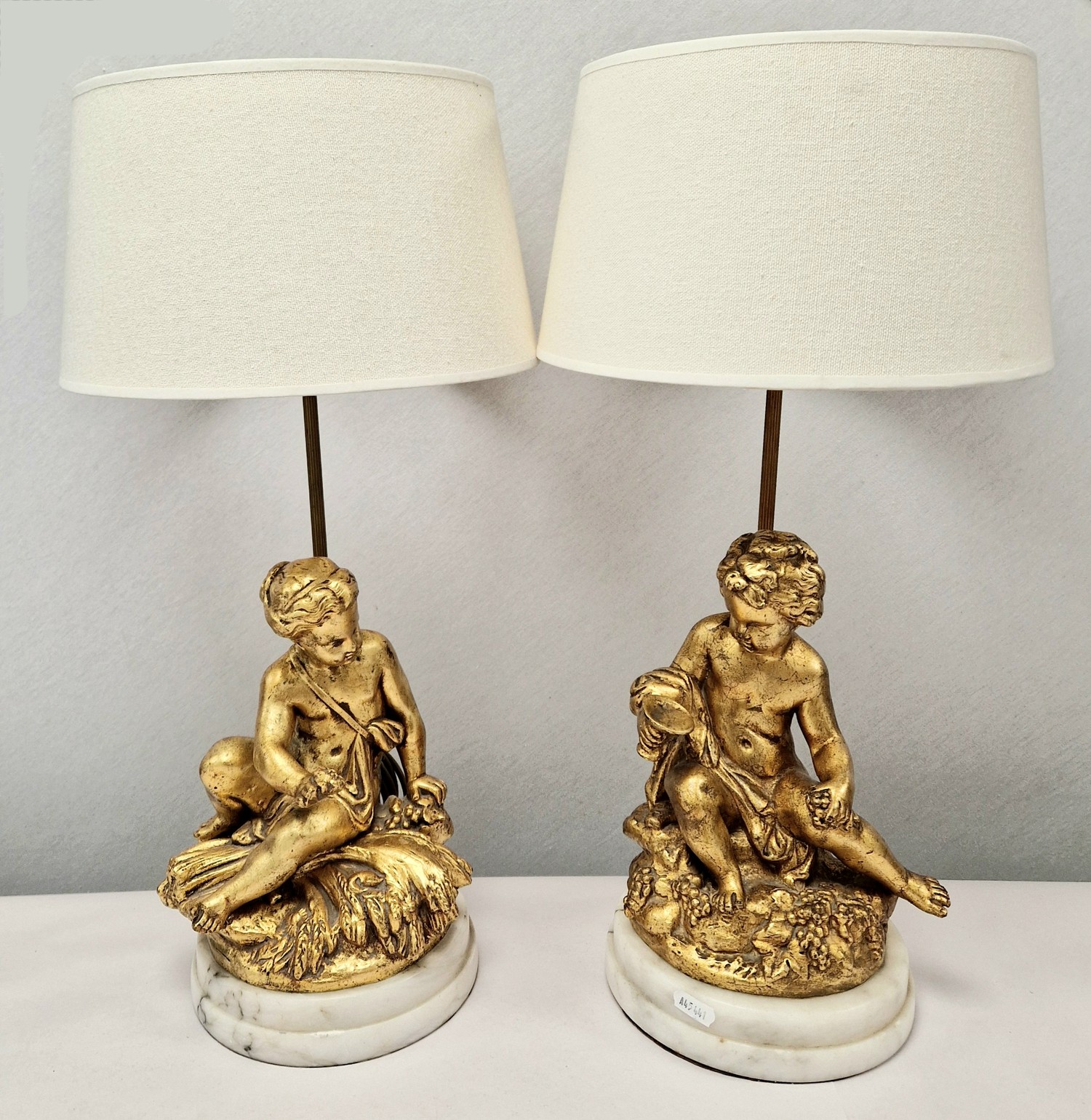 Two Cherub form table lamps with marble bases (2).