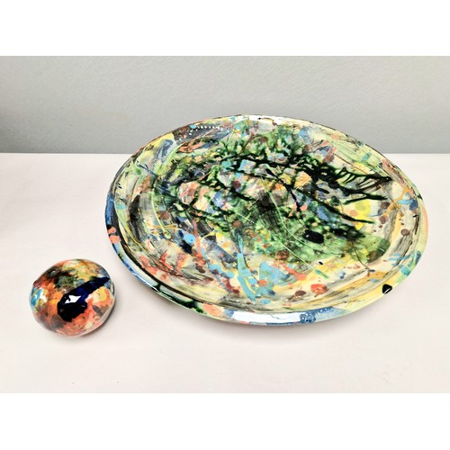 Cotemporary studio pottery charger with decorative ball.