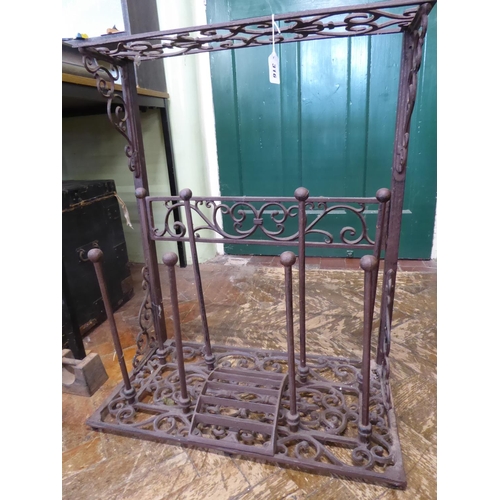 Ornate cast metal boot rack