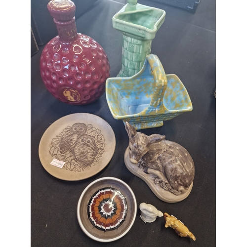 A collection of wade and Poole Pottery.