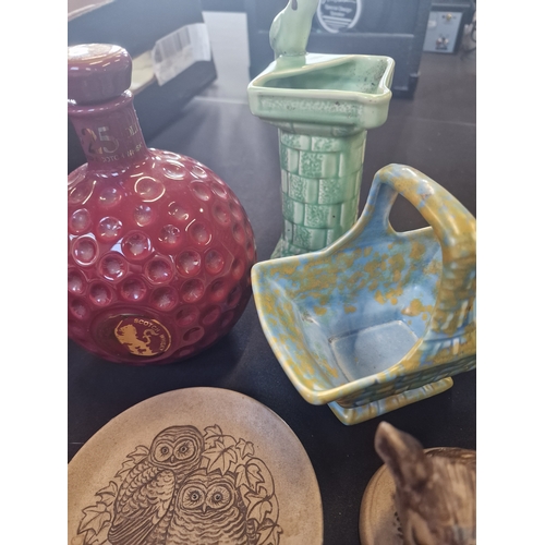 A collection of wade and Poole Pottery.