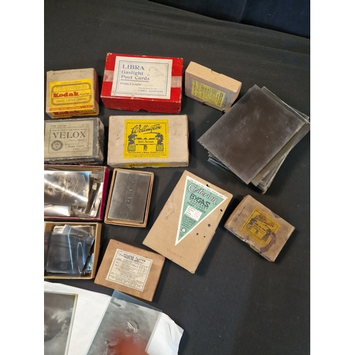 A large collection of vintage uaed glass plate films. Includes Velox ...