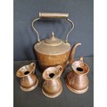 A selection of quarter, half and and one gill copper measuring jugs and ...