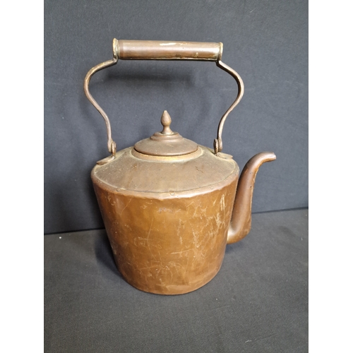 A selection of quarter, half and and one gill copper measuring jugs and ...