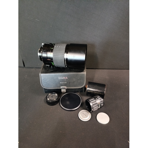 Sigma mirror-telephoto lens along with a Solitel Converter for Praktica