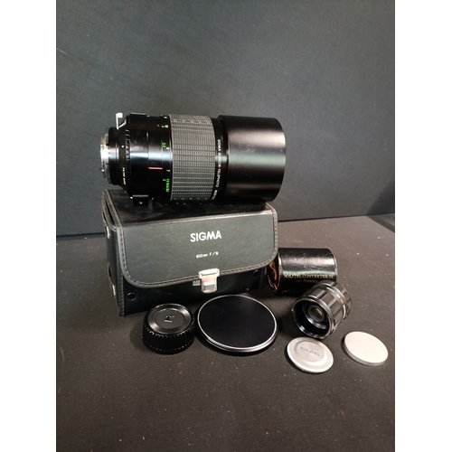 Sigma mirror-telephoto lens along with a Solitel Converter for Praktica