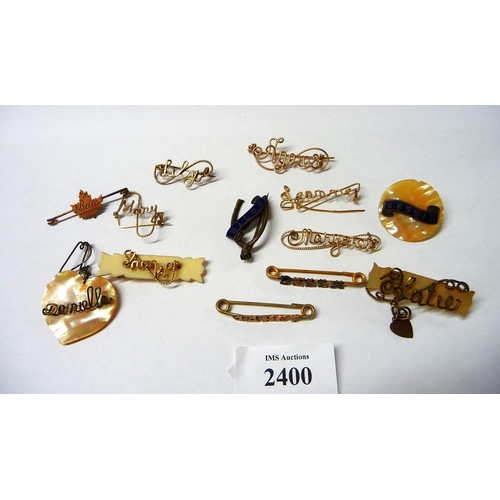 Box - Assorted Name Brooches.