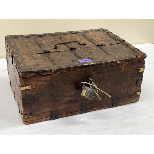 An antique Indian decorated and iron bound chest. 16' wide