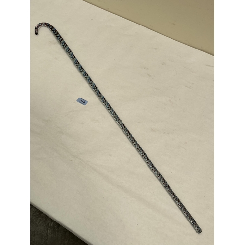 A 19th century glass walking cane 'frigger' with coloured double twist ...