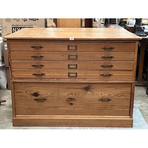 A pine plans chest of four shallow drawers over one deep drawer. 50" wide.