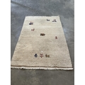 A thick pile wool rug. 72" x 49".