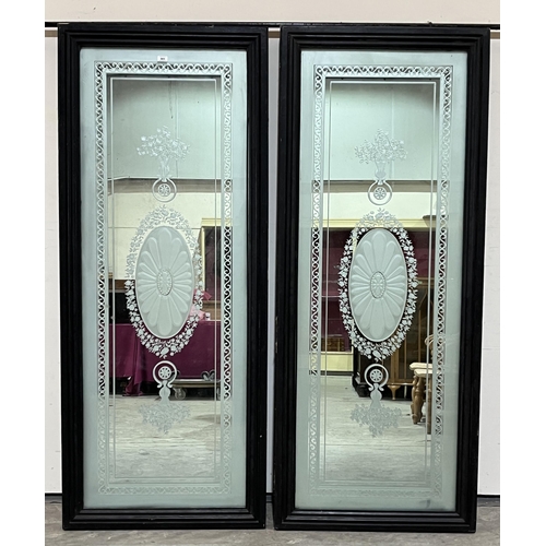 A pair of Regency style pier looking glasses, the plates etched and ...