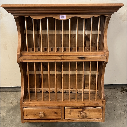 A pine plate rack with two drawers. 36" high