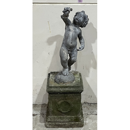 A lead garden statuary figure of a putto on a pedestal base. 41" high ...