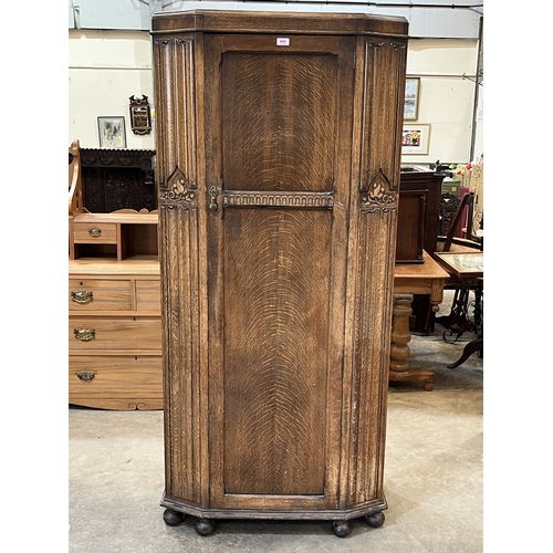 A 1930s oak hall robe