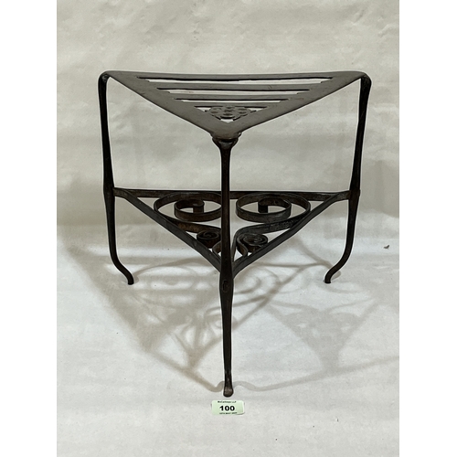 An 18th century wrought iron trivet. 13" high