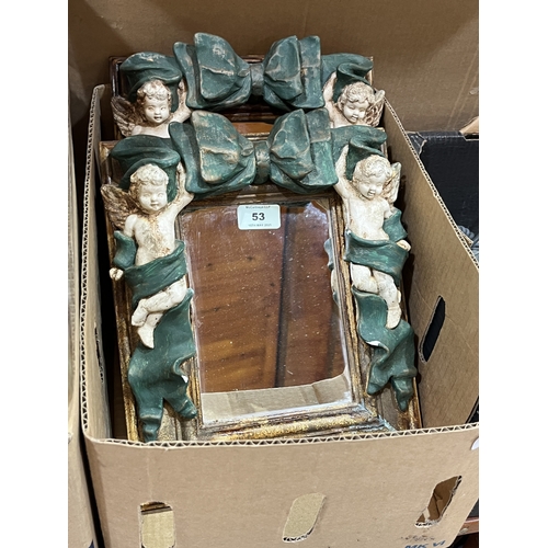 A pair of Alan Wallis Designs cherubic wall mirrors. 12" high