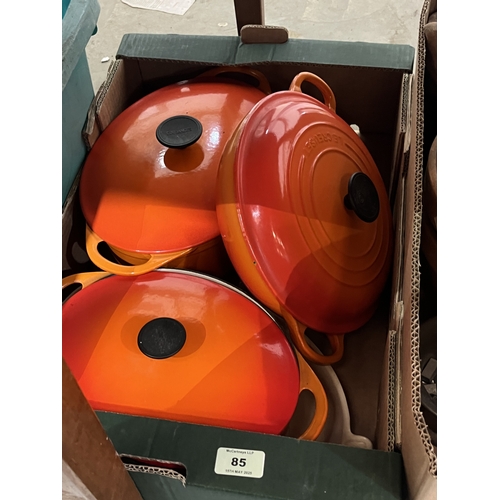 A box of Le Creuset and Cousances cookware
