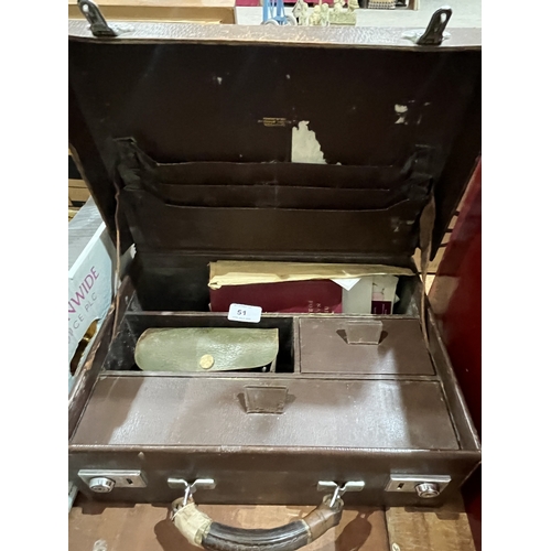 A leather medical case and contents