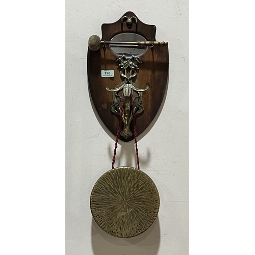 A late Victorian brass and stained beechwood dinner gong with mirror ...