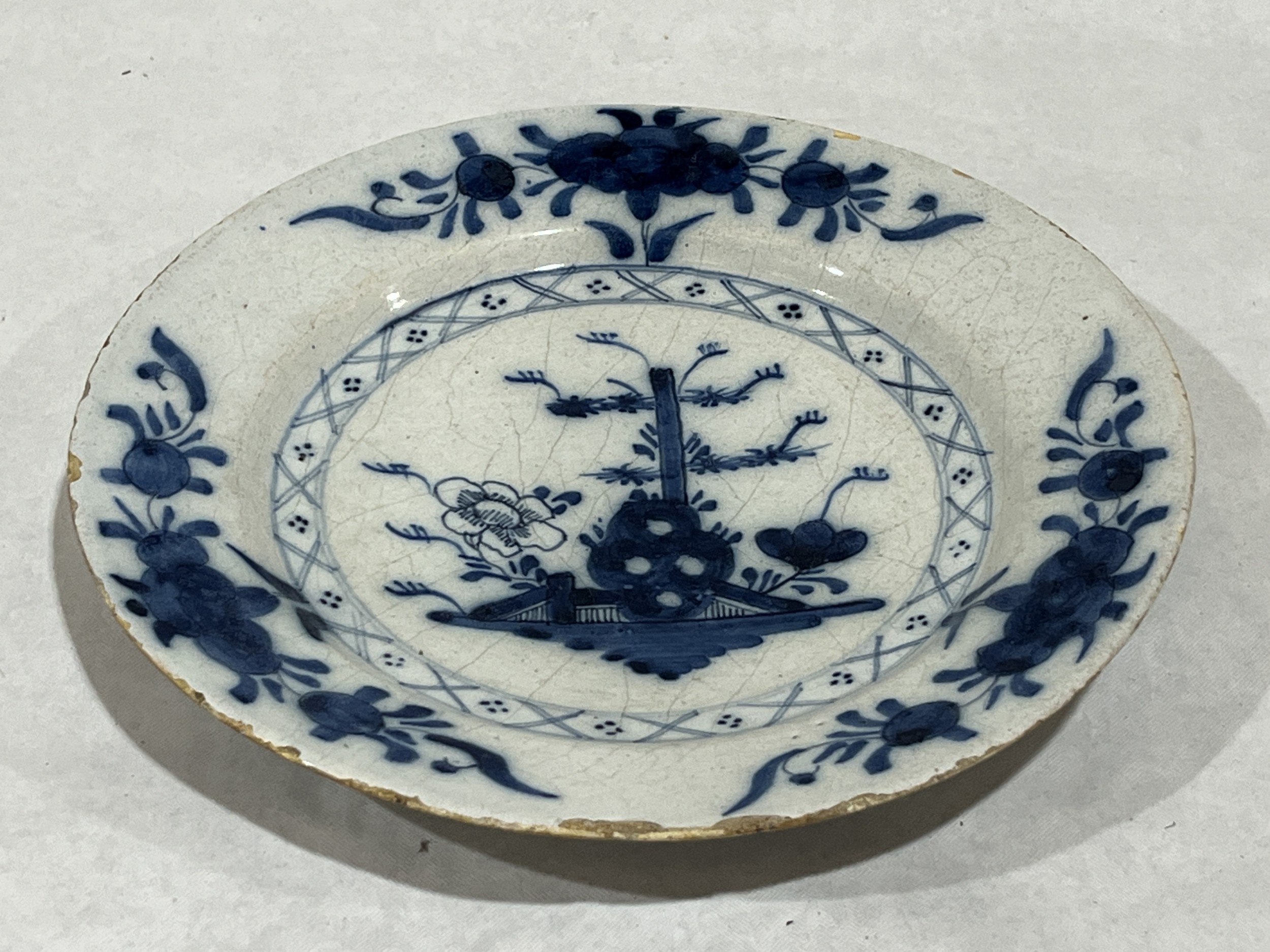 18th century English Delft ware Bridge tree and peony to the centre ...