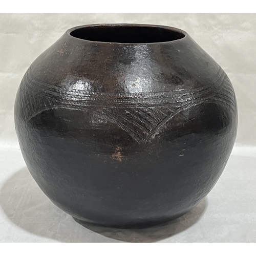African Zulu sorghum beer brewing and serving pot or ukhamba, coil ...
