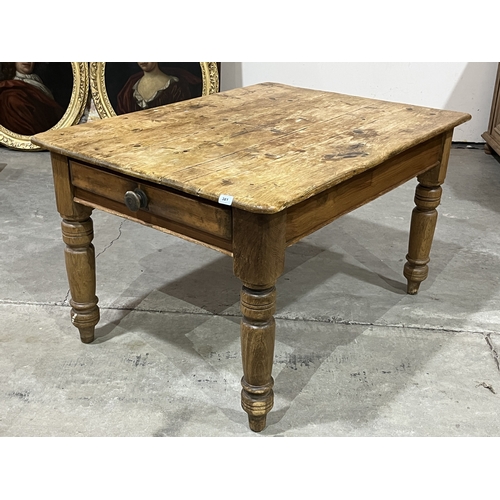 A Victorian pine kitchen table with a frieze drawer, on turned legs ...
