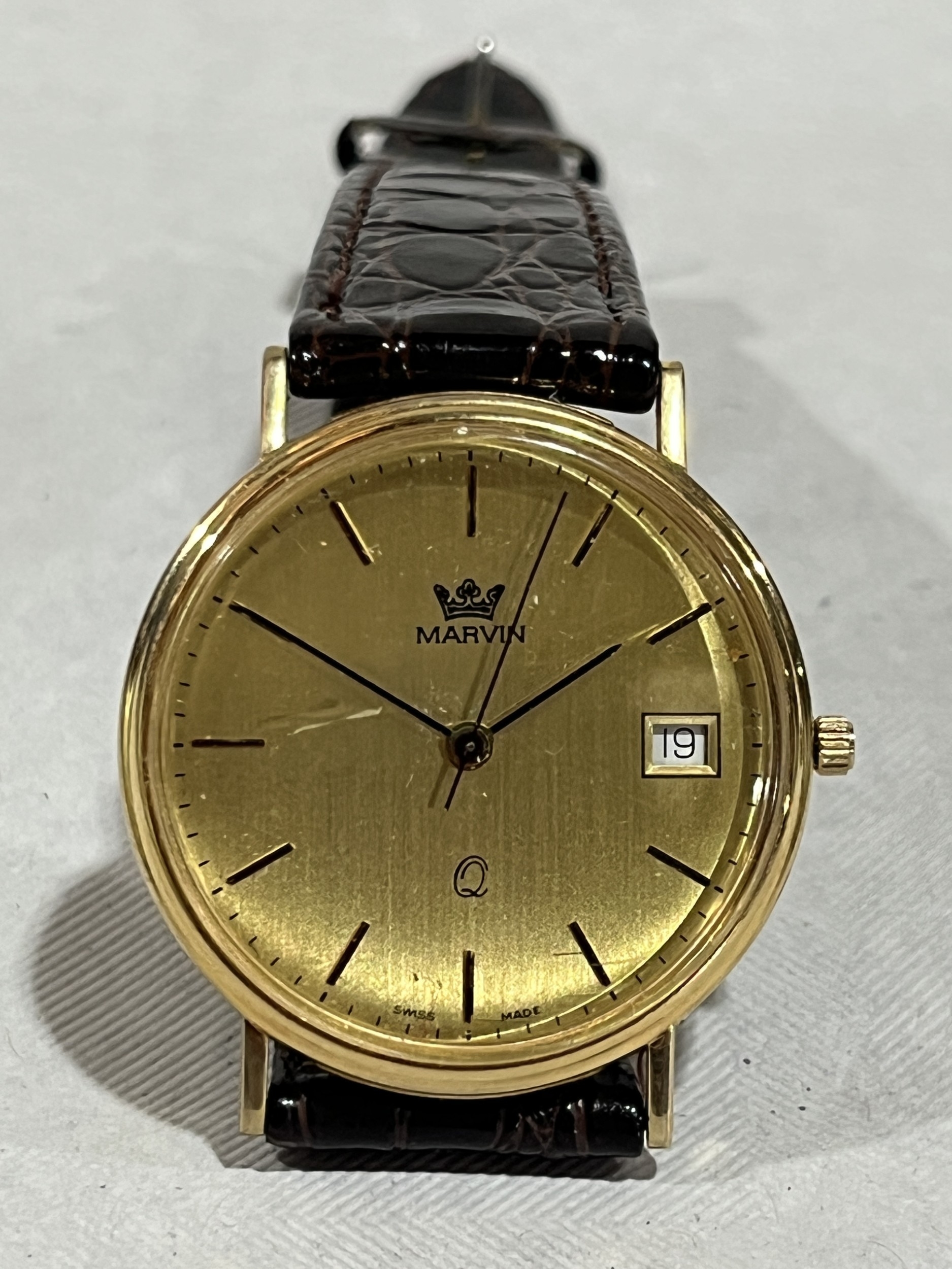 A 9ct cased Marvin gentleman's wristwatch, the frosted dial with date ...