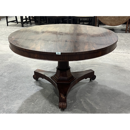 A William IV rosewood snap top supper table, on tripartite platform ...