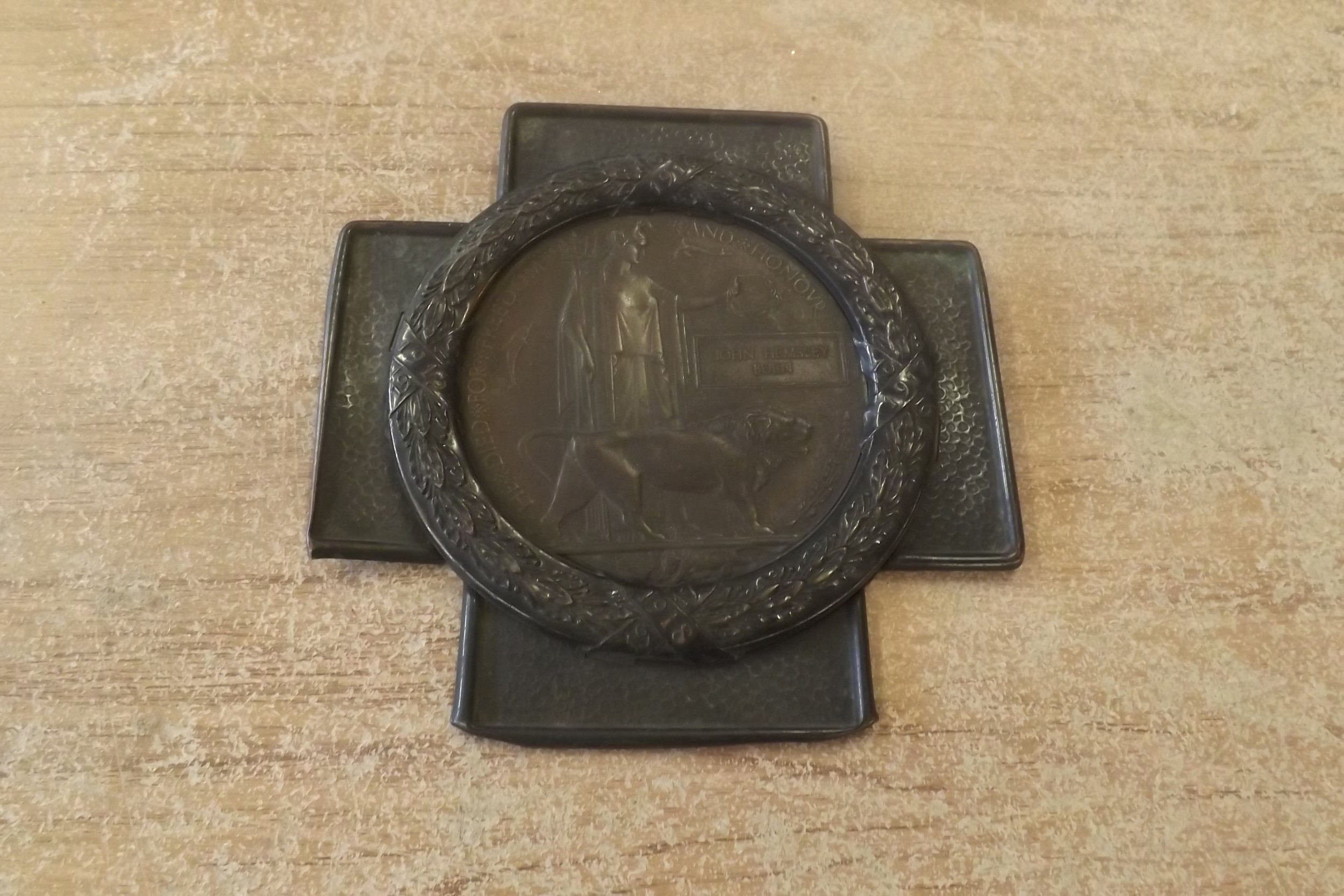 Named WW1 Death penny in bronze cross frame nice example. john hemsley burn