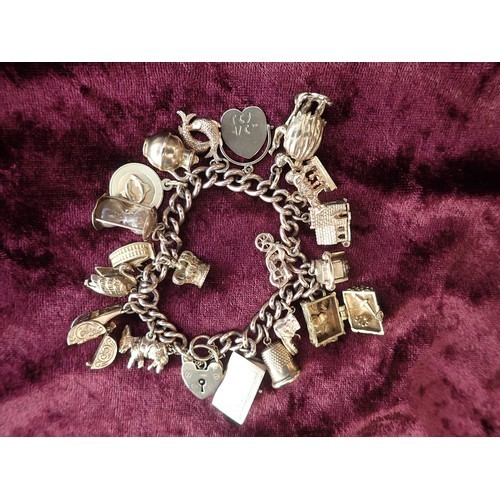 Stunning Heavy 9K Gold Charm bracelet with 19 charms. 2 x 18k. The ...
