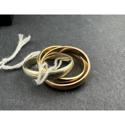 Jewellery: A 9ct gold puzzle ring in a Russian style, three interlinked ...