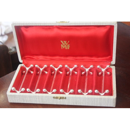 A set of six WMF silver-plated knife rests, in lined box, 19cm wide.