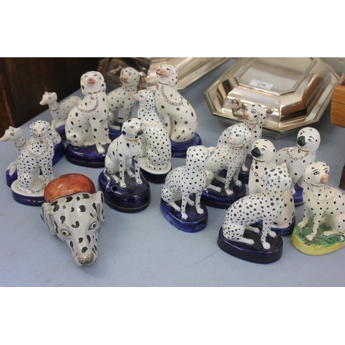 A collection of Rockingham and Staffordshire pottery figures of ...