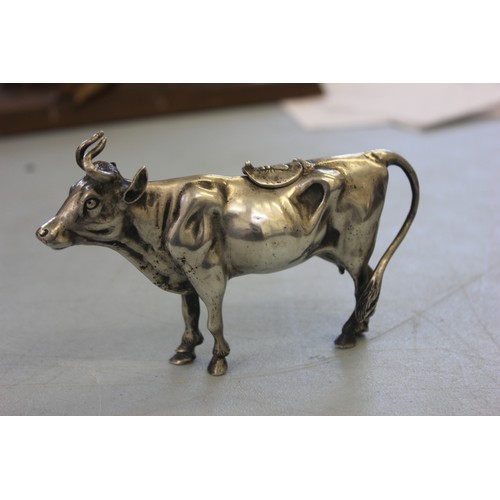 An 18th century German silver cow creamer, 13cm long.