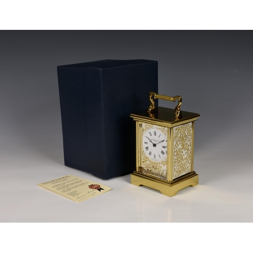 A Taylor and Bligh cased carriage clock, the bevelled glass with ...