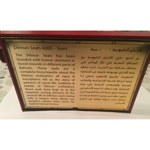 A cased corporate gift set of six gold plated Dilmun Seals.,