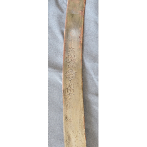 A Turkish Yatagan short sword the 22¾in. (57.8cm.) curved blade ...