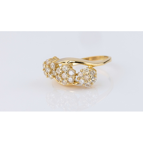 An 18ct yellow gold and diamond triple floral cluster ring, the three ...