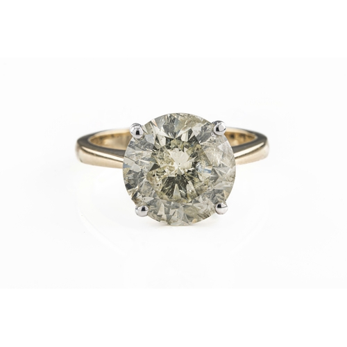 A 18ct yellow and white gold large round brilliant cut diamond ...