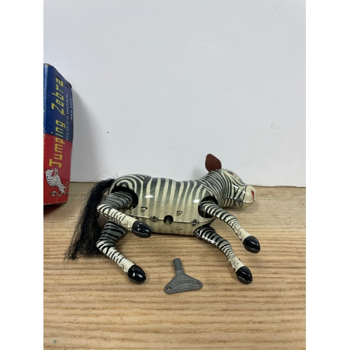 Vintage Jumping Zebra Clockwork Toy in Original Packaging.