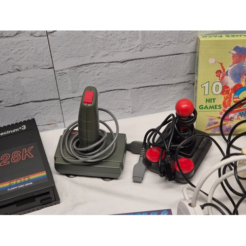 A Sinclair ZX Spectrum +3 by Amstrad to include Games, Joystick ...